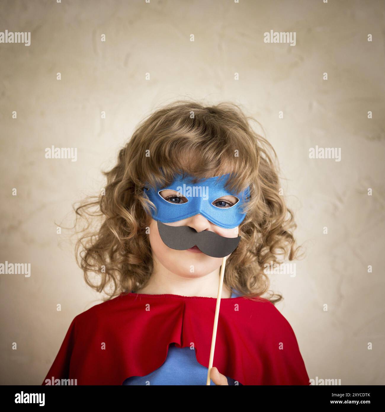 Superhero kid with fake hipster mustache Stock Photo - Alamy