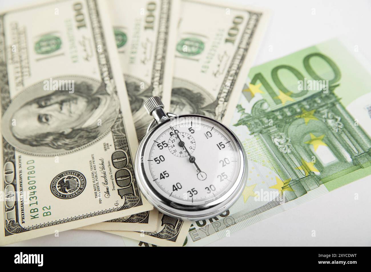 Time is money, stopwatch on bills. Concept Stock Photo - Alamy