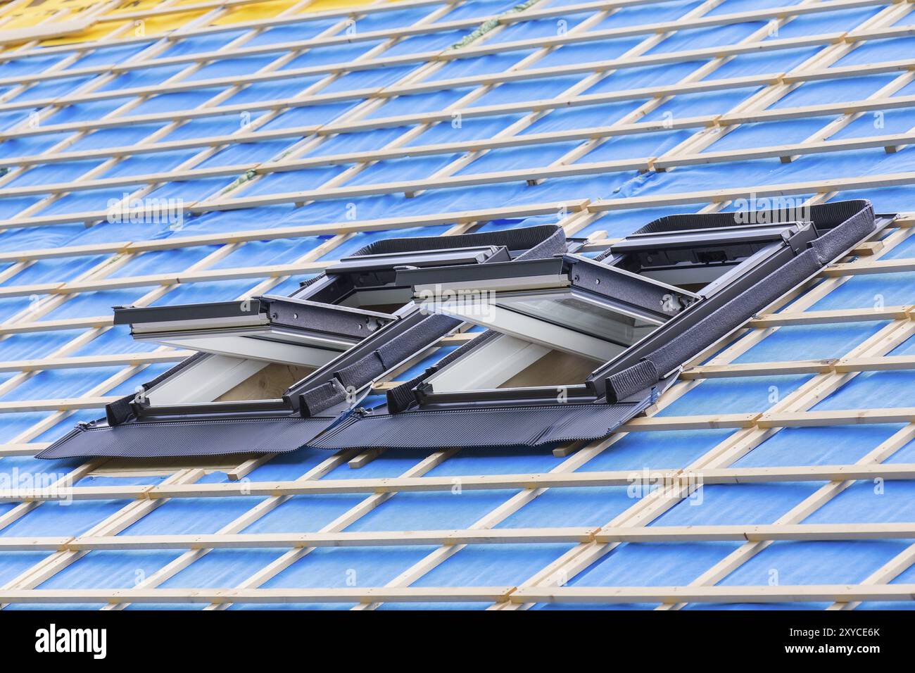 Two new roof windows together on roof of a new home Stock Photo - Alamy