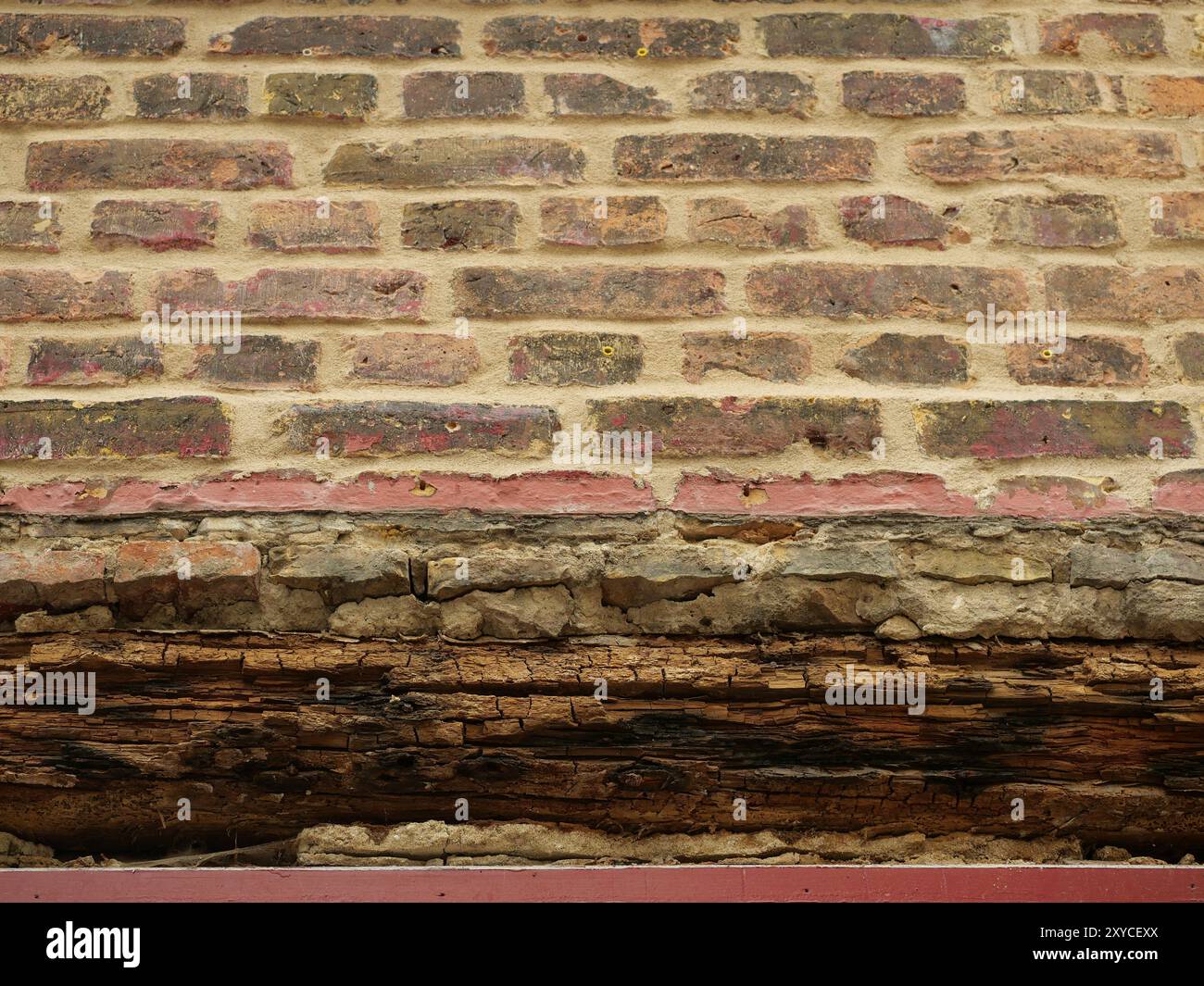 Exposed masonry with decayed wooden lintel over a window opening during ...