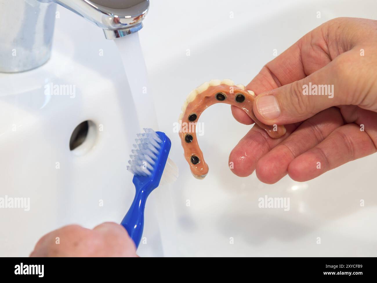 Denture cleansing hi-res stock photography and images - Alamy