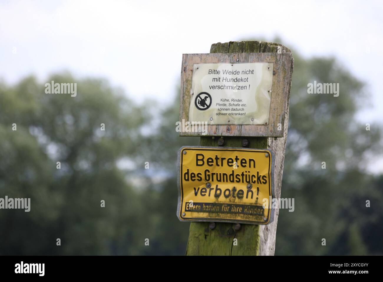 Signs on a fence post Stock Photo - Alamy