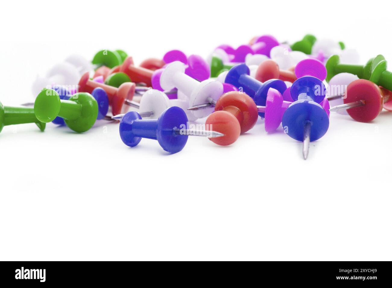 Colorful mixed-up pins isolated on white Stock Photo - Alamy