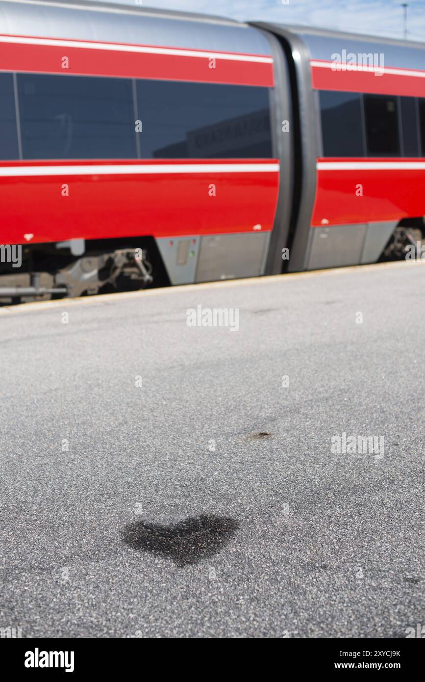 Heart shaped water spillage in front of a train Stock Photo - Alamy