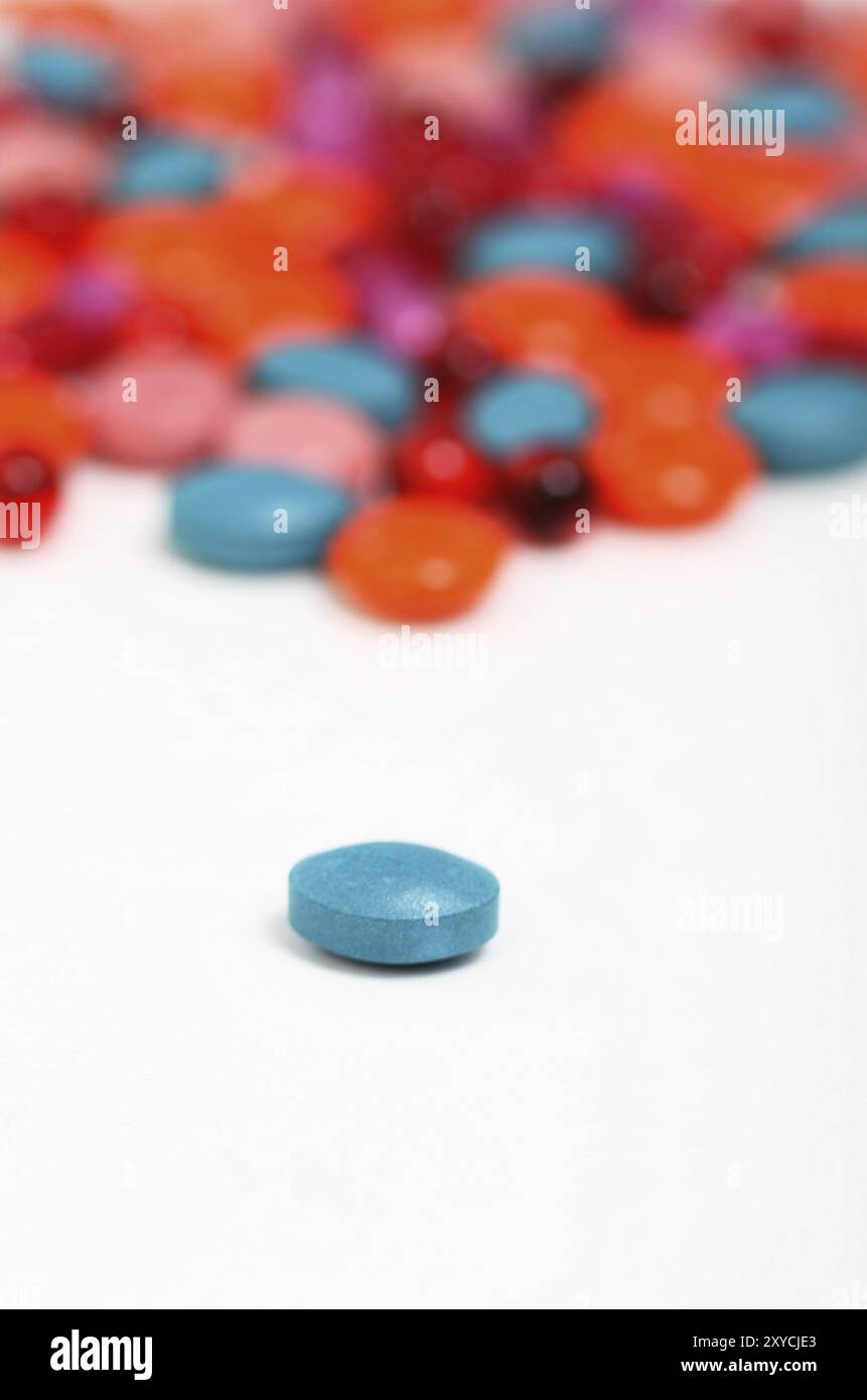 Multicolor pills and capsules on white background Stock Photo - Alamy