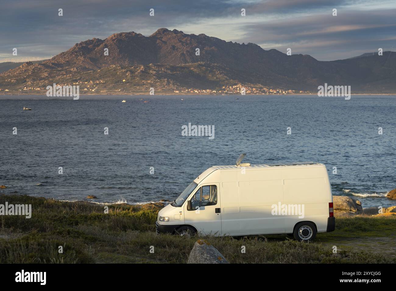 Camper van motorhome with solar panels view on a sea landscape with ...