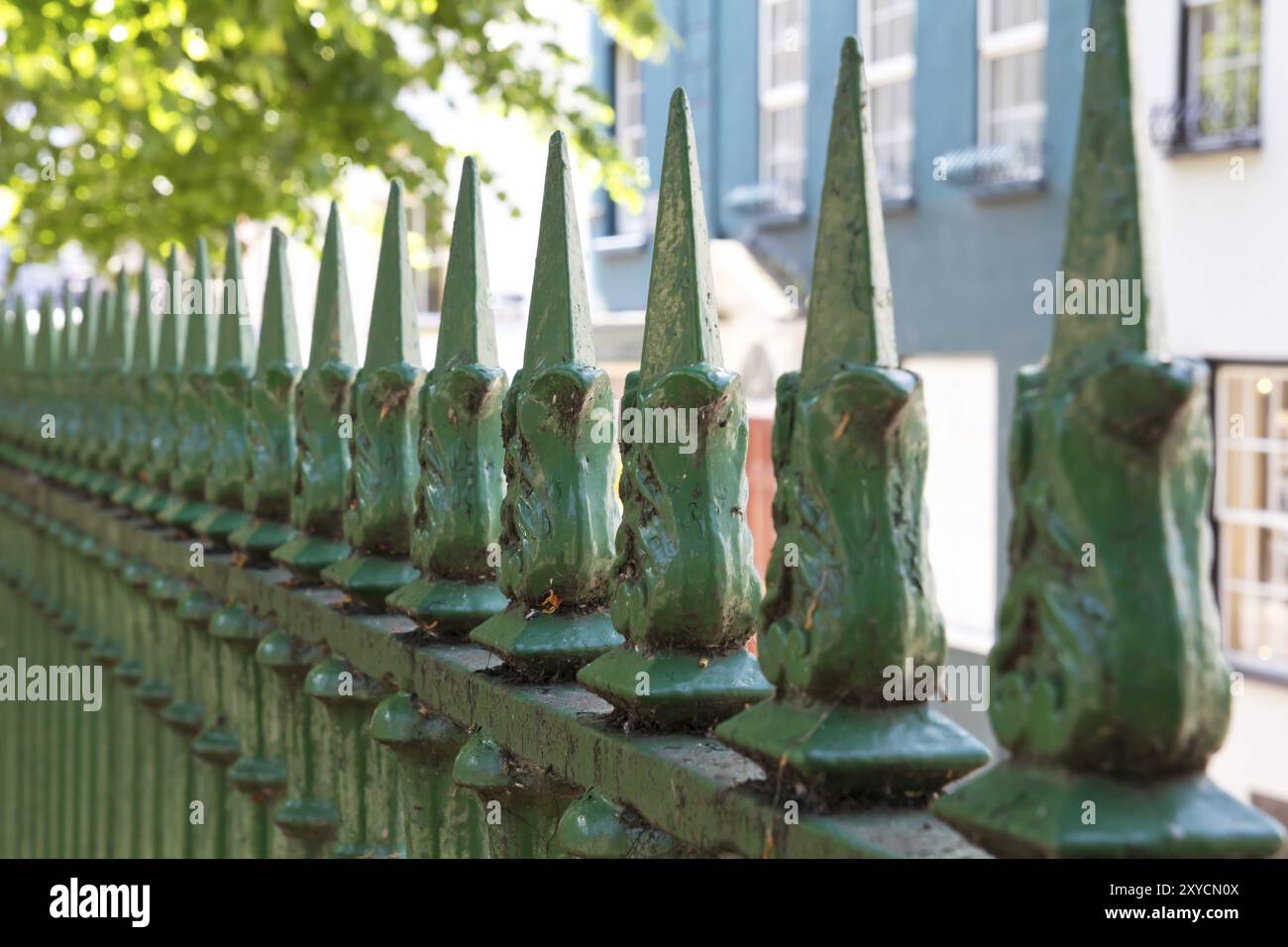 Wrought iron fence with spikes Stock Photo - Alamy