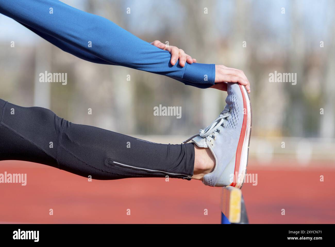 Sportsman stretching sports place hi-res stock photography and images ...