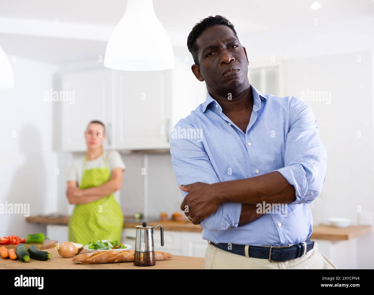 Man standing kitchen stressed hi-res stock photography and images - Alamy