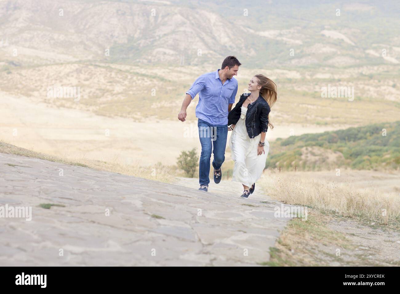Young beautiful woman happily running hi-res stock photography and ...