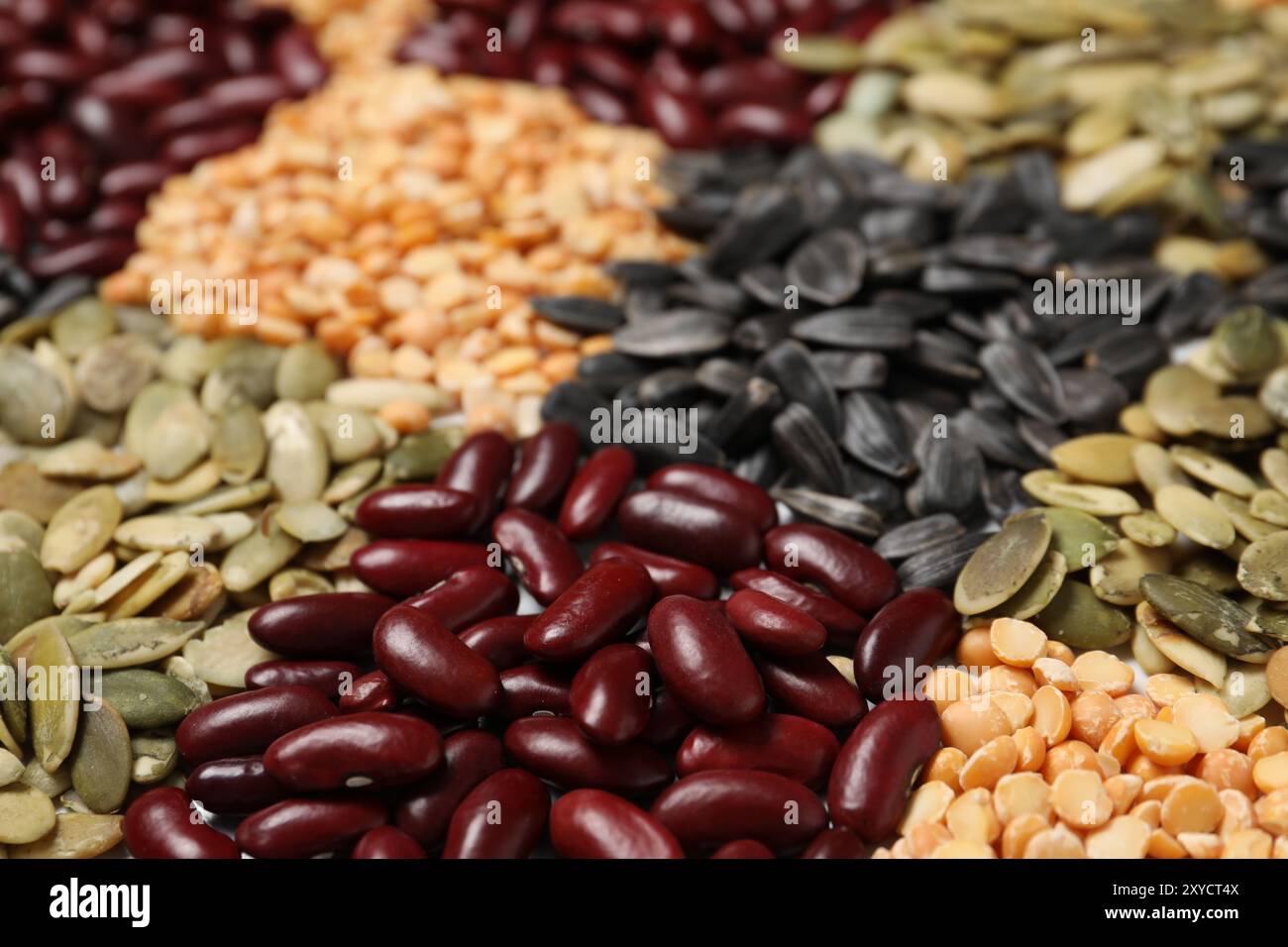 Different types of legumes and seeds on table, closeup Stock Photo - Alamy