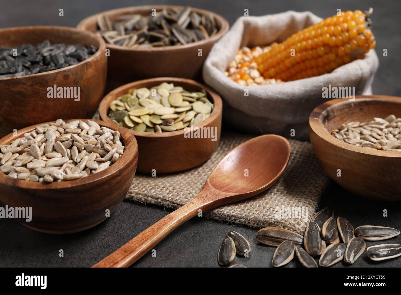 Different types of seeds and legumes on grey table Stock Photo - Alamy