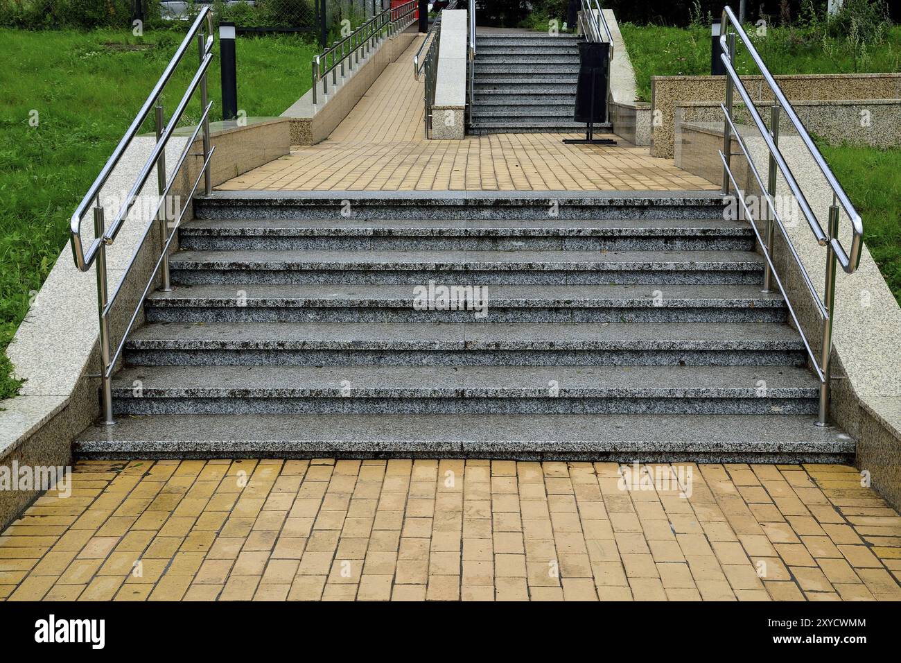 Ramp for wheelchair entry and stairs with railings Stock Photo - Alamy
