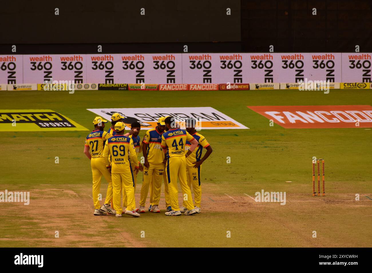 Team Mysore Warriors in a group discussion during the match at the Maharaja Trophy T20 2024 in M ...