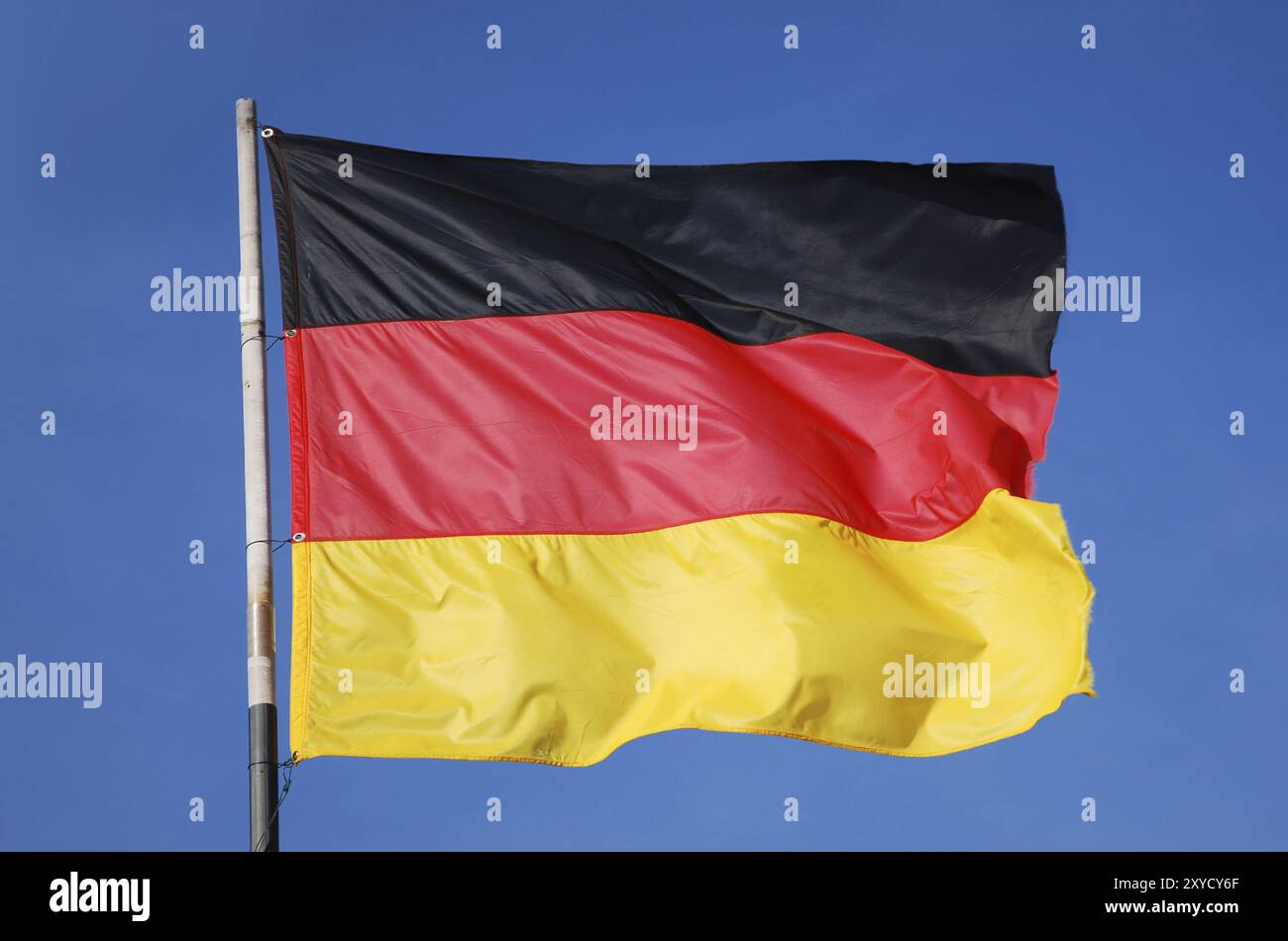 Waving flag deep blue sky hi-res stock photography and images - Alamy