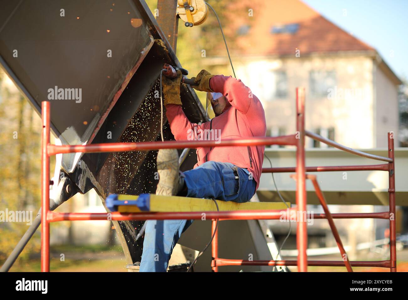 Man working on construction of Saint Barbara bridge Stock Photo - Alamy