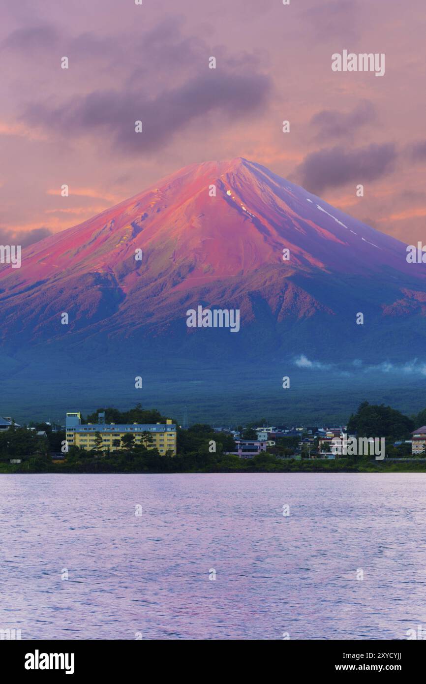 Colorful pink sky above the red volcano crater cone of Mount Fuji over ...