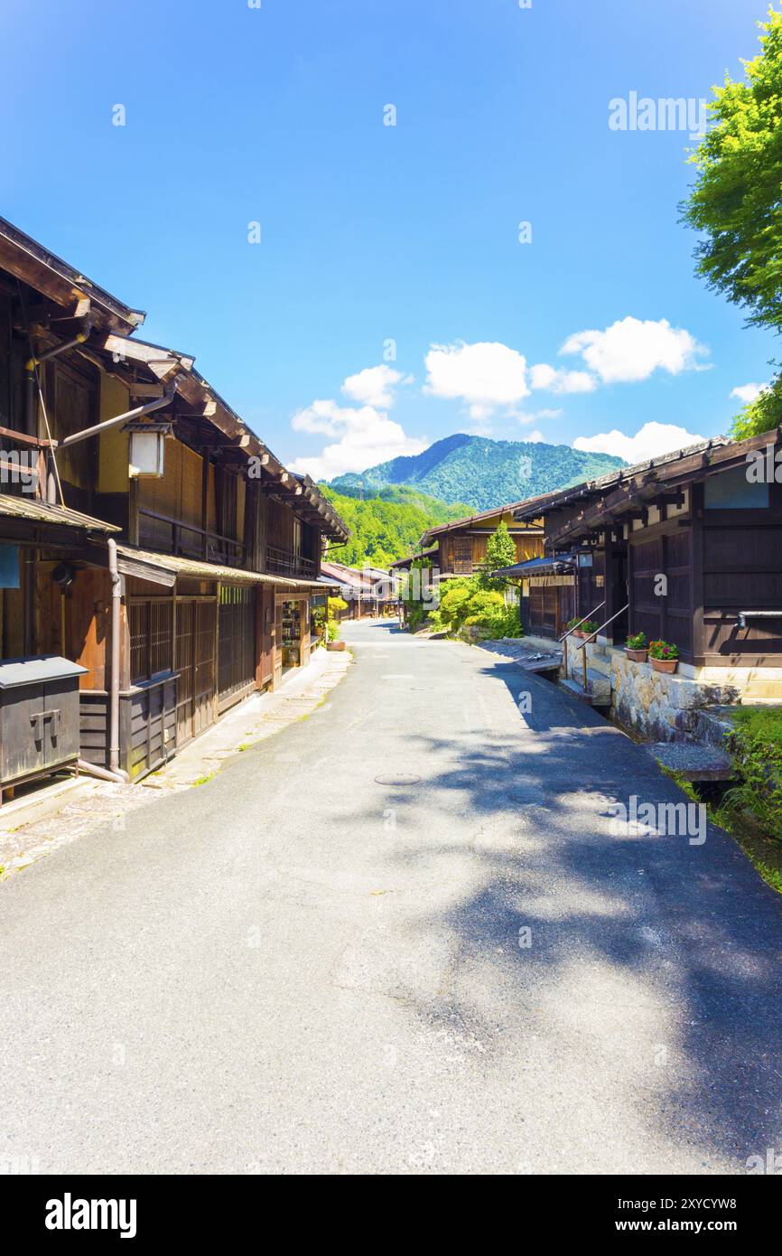 Traditional wooden buildings line the sides of the main street of ...