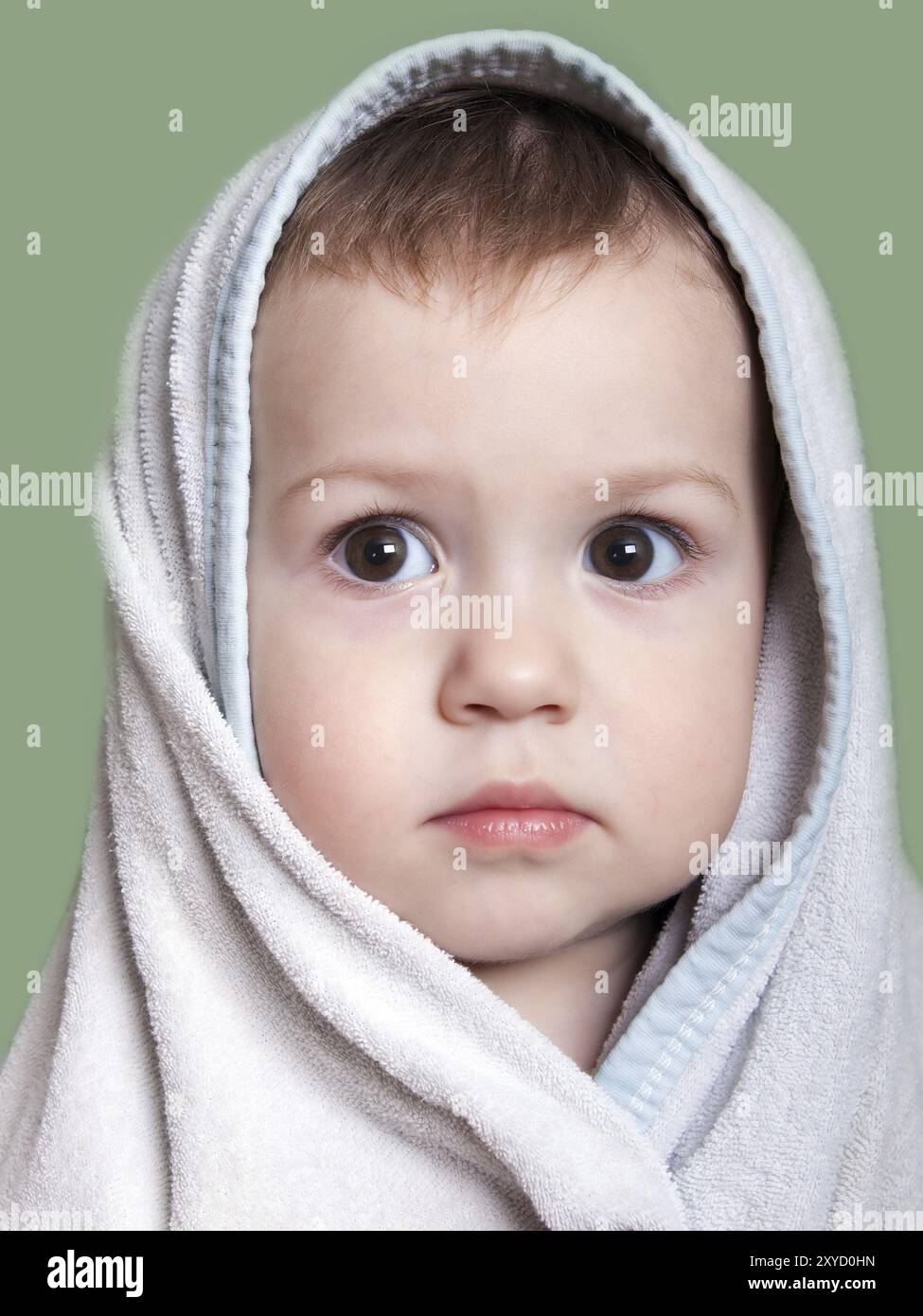 Cute little human baby child eyes on face in towel Stock Photo - Alamy
