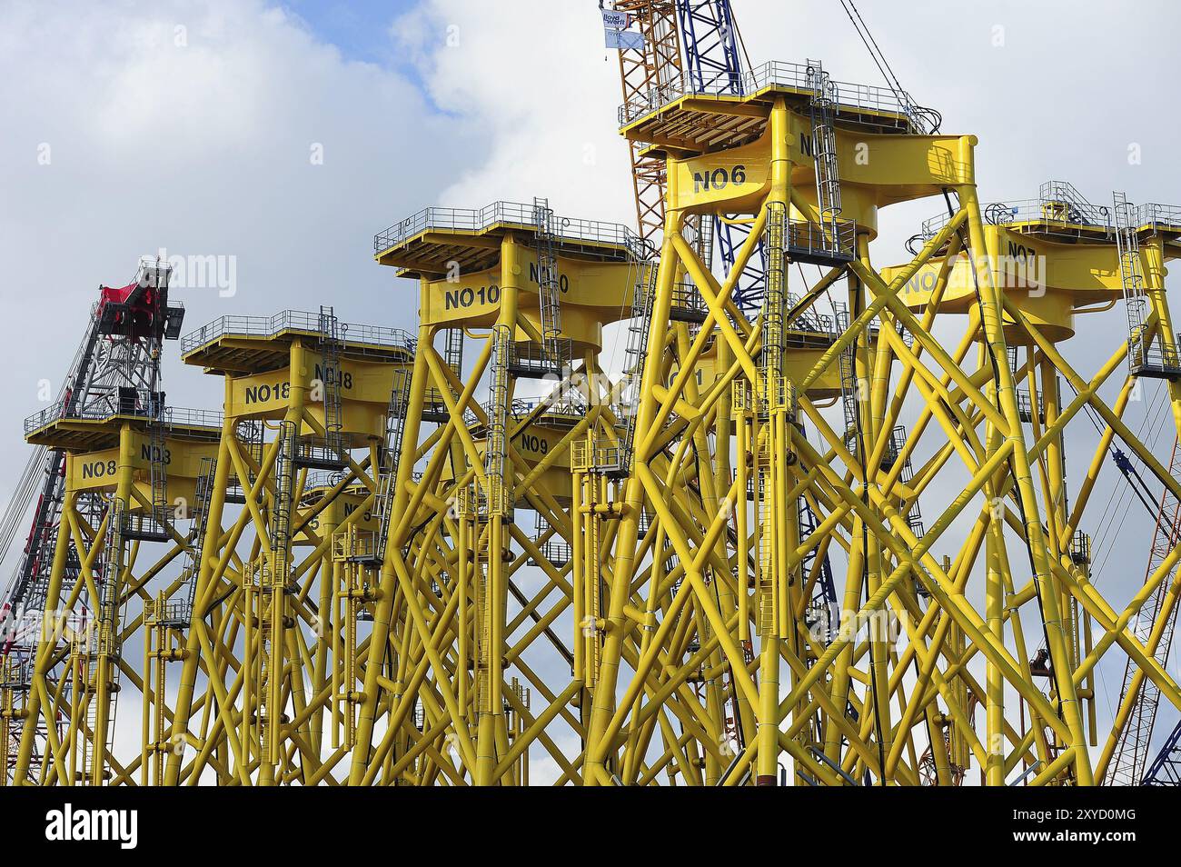 Jacket foundations are lifted onto a pontoon. Jackets shifted on a ...
