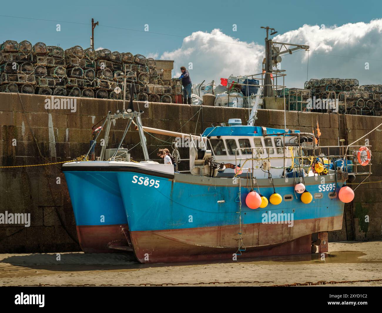 Fishing boat on a high tide in the harbour hi-res stock photography and ...