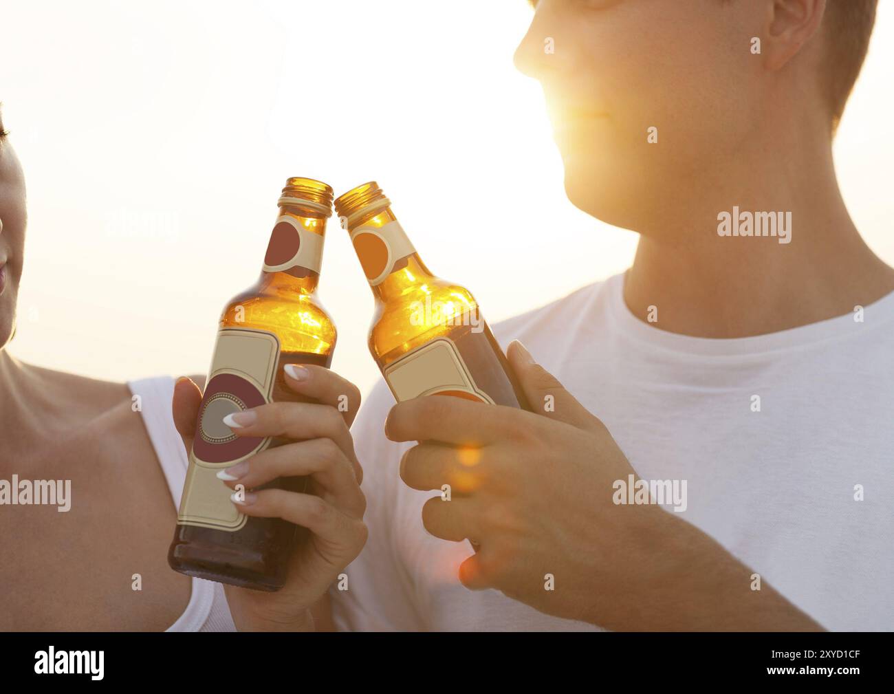 Couple on the beach having party, drinking and having fun in the sunset ...