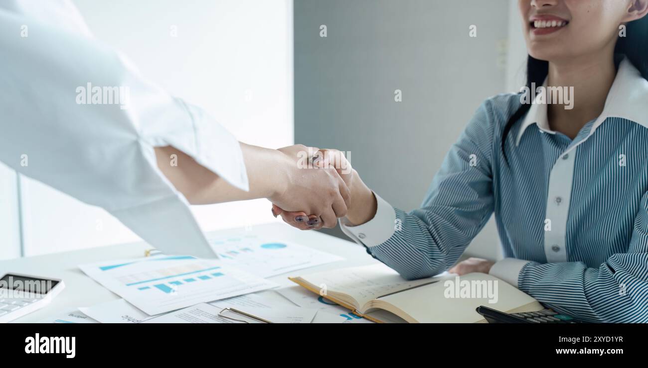 Professional Business Handshake in Modern Office Setting with Documents ...