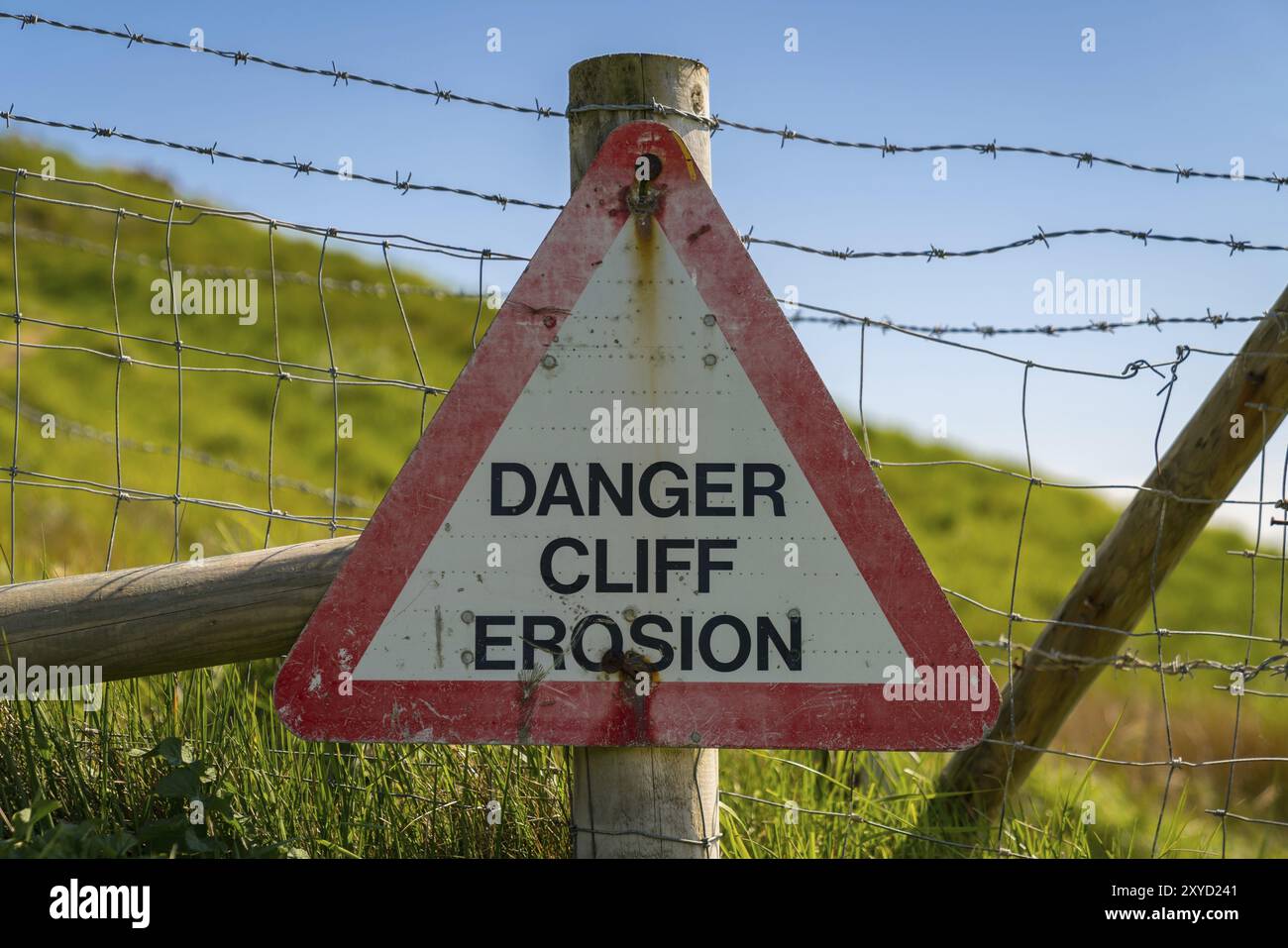 Sign: Danger cliff erosion, seen at Worbarrow Bay, Jurassic Coast ...