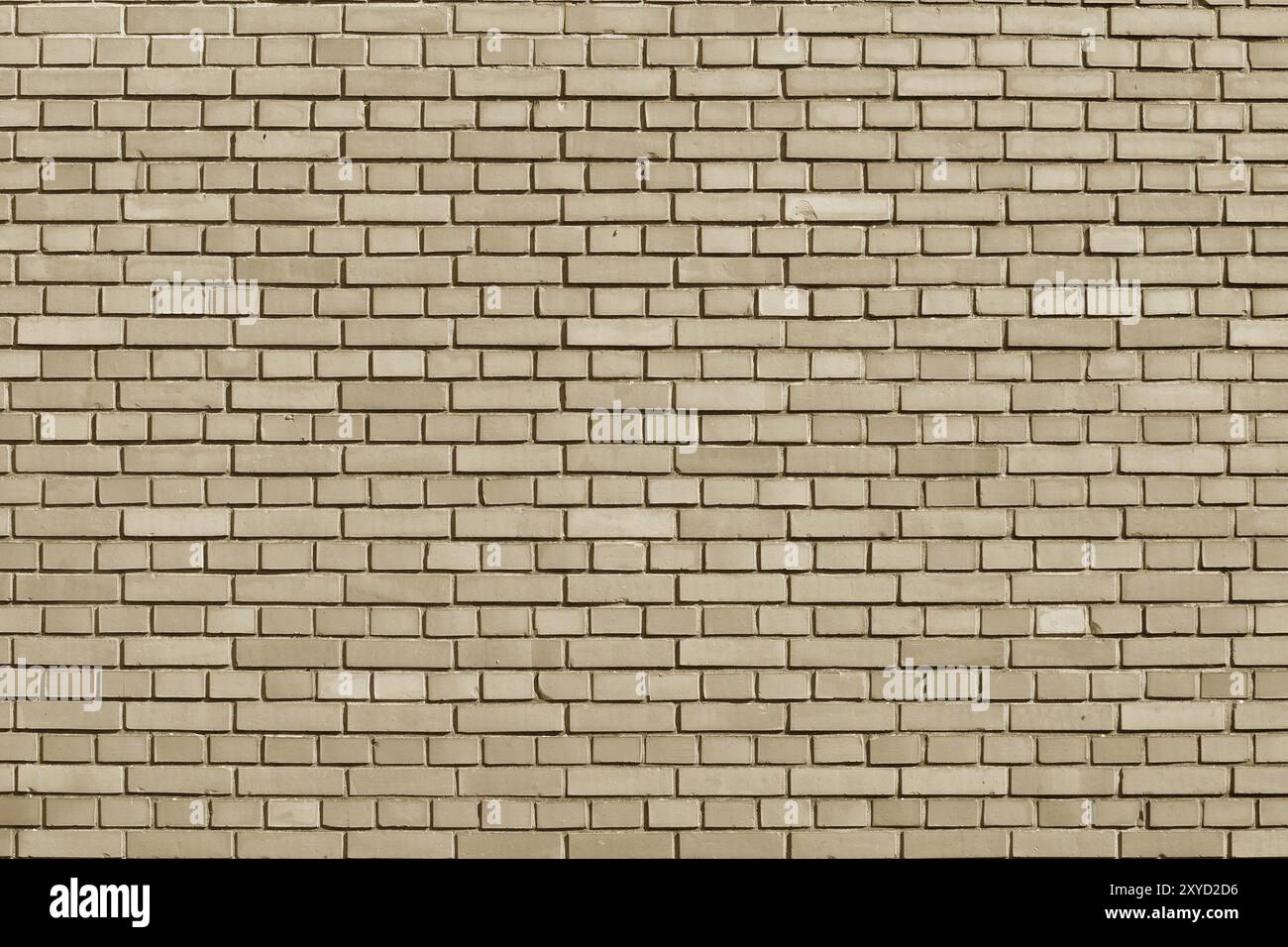 Almond Buff colored brick wall background Stock Photo - Alamy