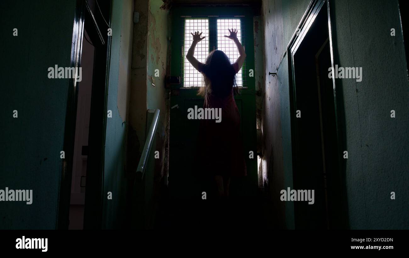 Frightened woman and shadow hi-res stock photography and images - Alamy