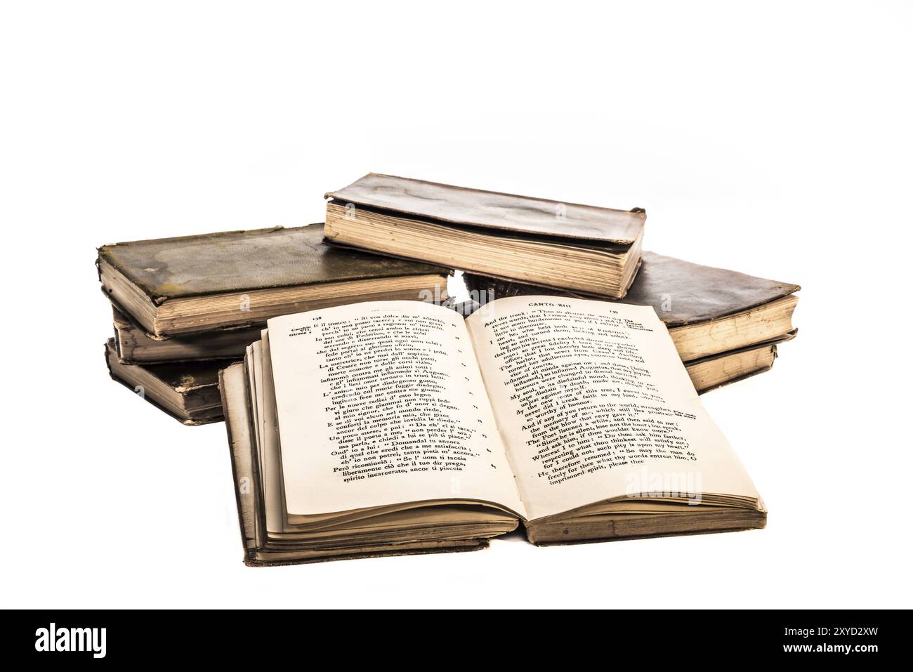 Old neglected books placed in to a small heap of two stacks with one of ...