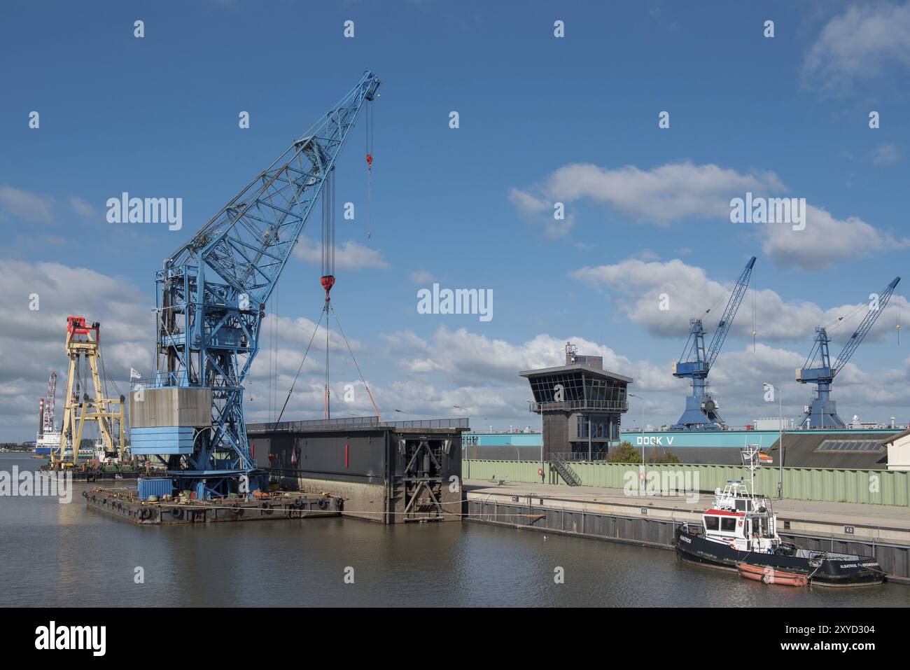 Crane at construction site with freight vehicle hi-res stock ...