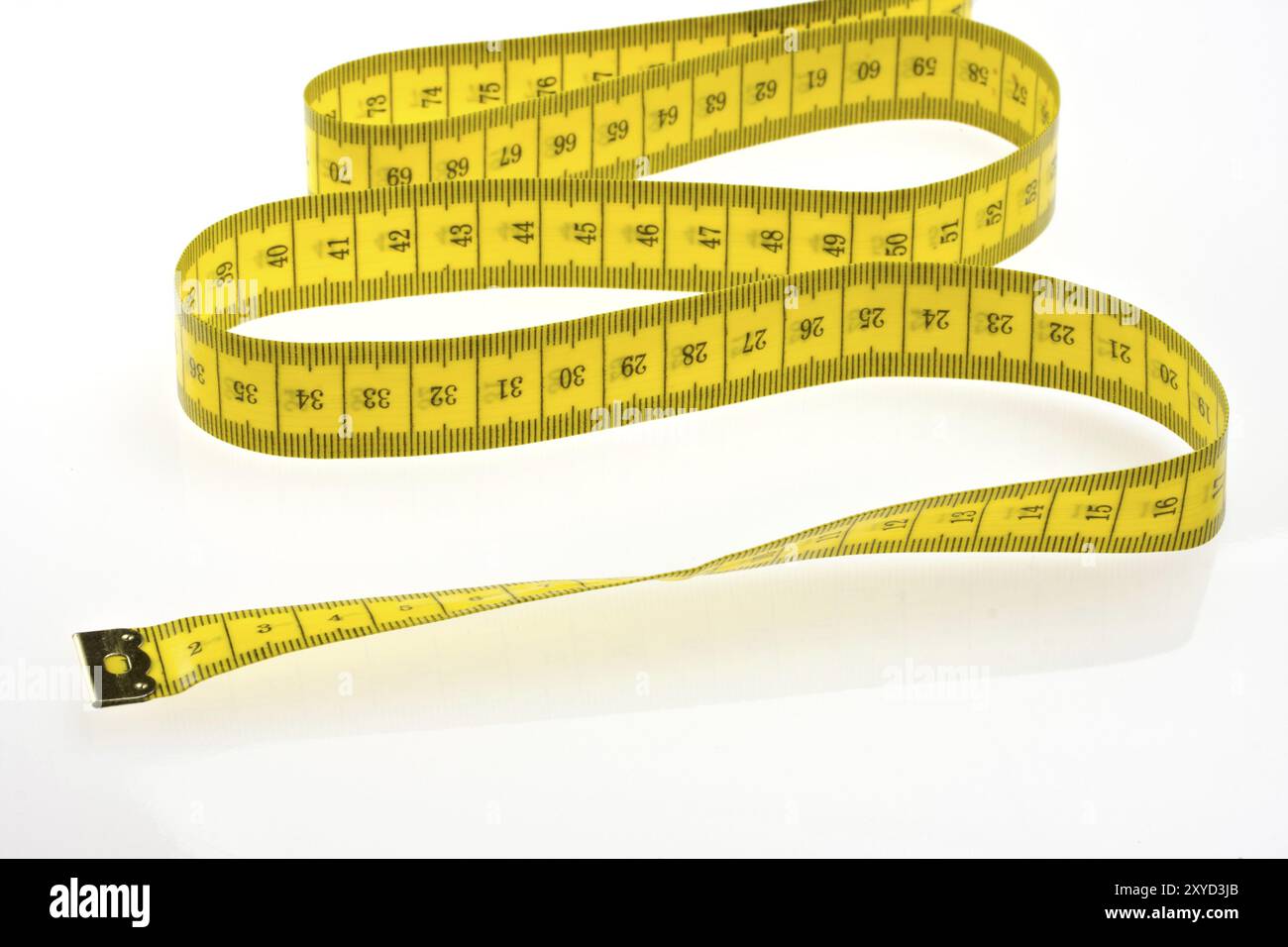Yellow measuring tape isolated on white background Stock Photo - Alamy