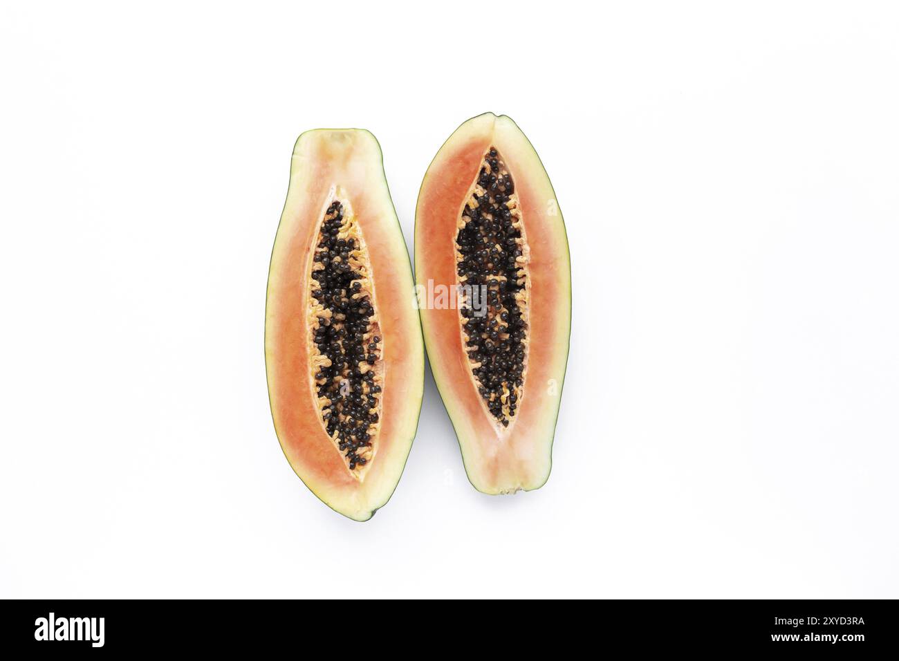 Isolated two halves of papaya fresh tropical fruit on white background ...