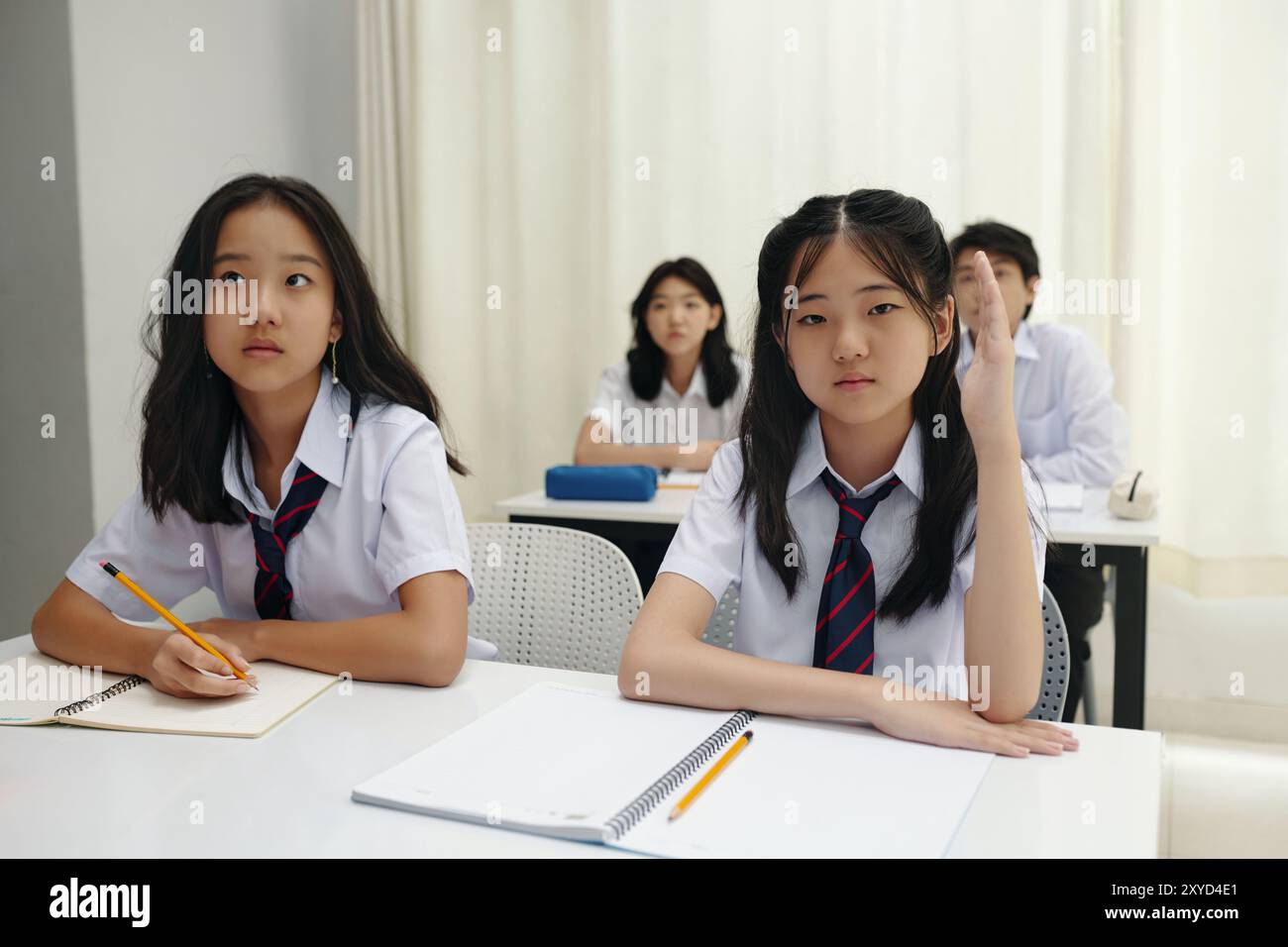 Students Attending Classroom Lesson Wearing Uniforms Stock Photo - Alamy
