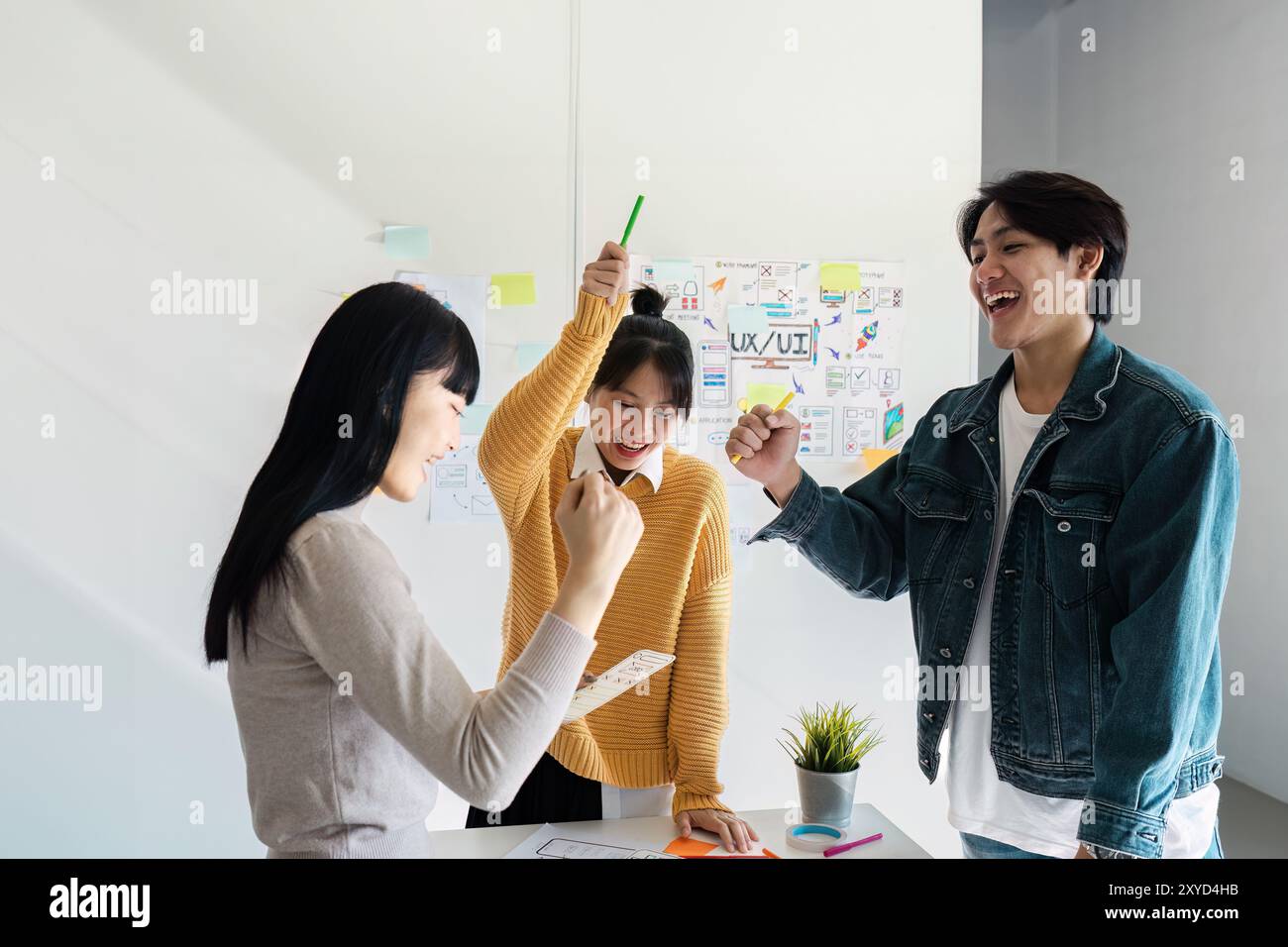 Creative Team Collaborating On Ux Ui Design Project In Modern Office