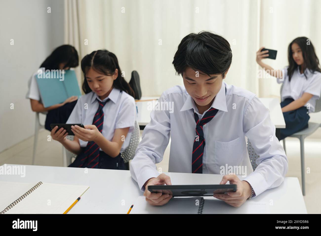 Engaging Students in Classroom with Digital Devices Stock Photo - Alamy