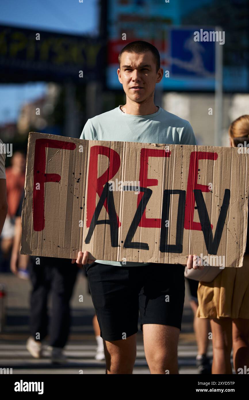 Ukrainian man walking with a sign Free Azov on a peaceful demonstration ...