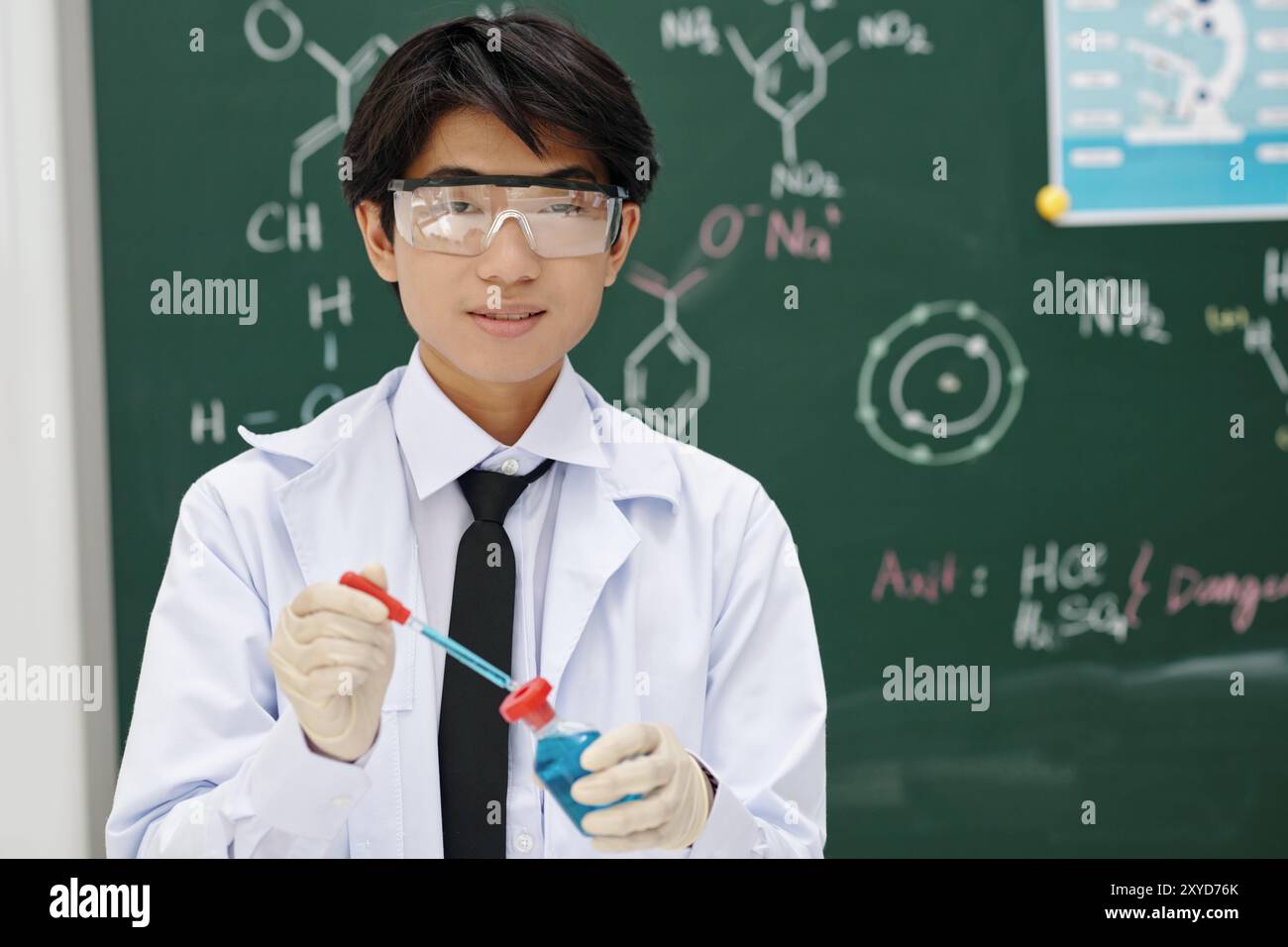Conducting Chemistry Experiment in Laboratory Stock Photo - Alamy