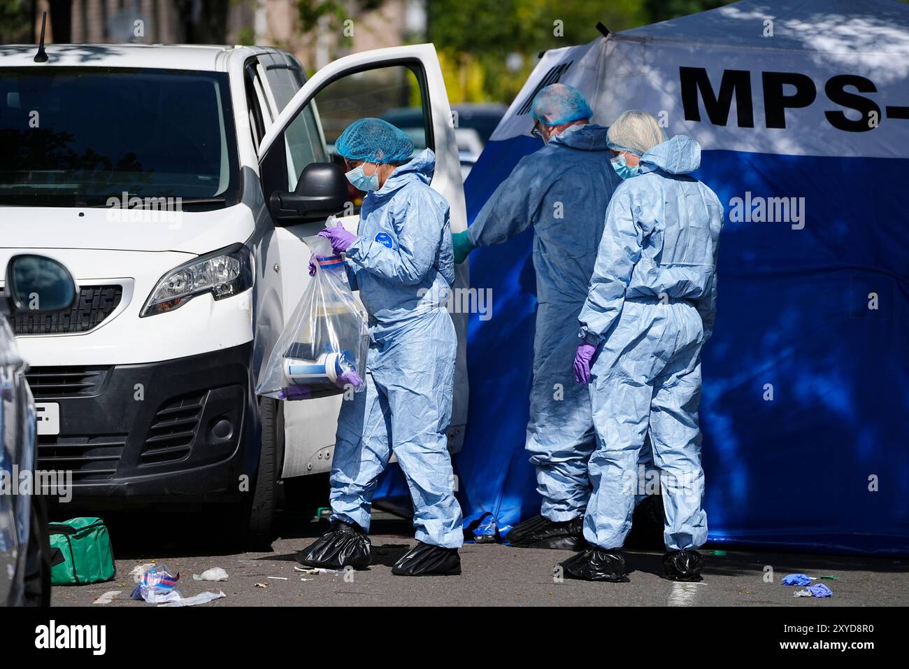 Forensic police officers on Overbury Street near the scene in Rushmore ...