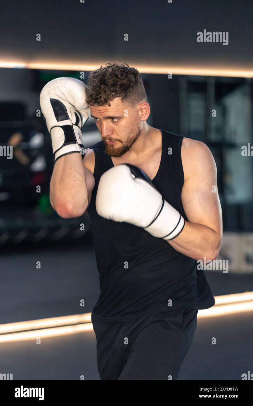 Working boxer in boxing gloves. A boxer in training Stock Photo - Alamy