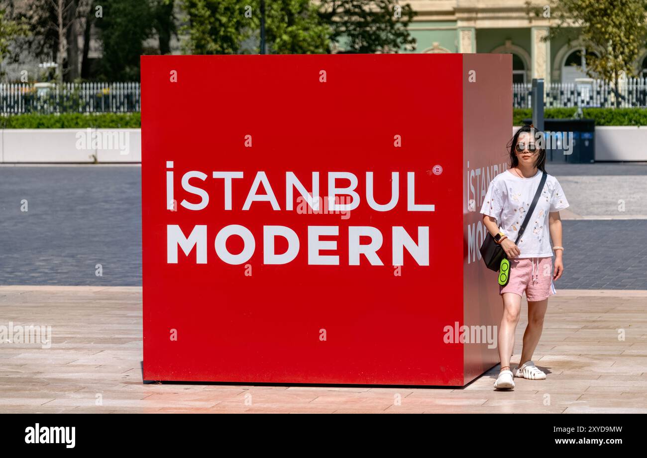 Istanbul Museum of Modern Art, with female tourist standing next to the ...