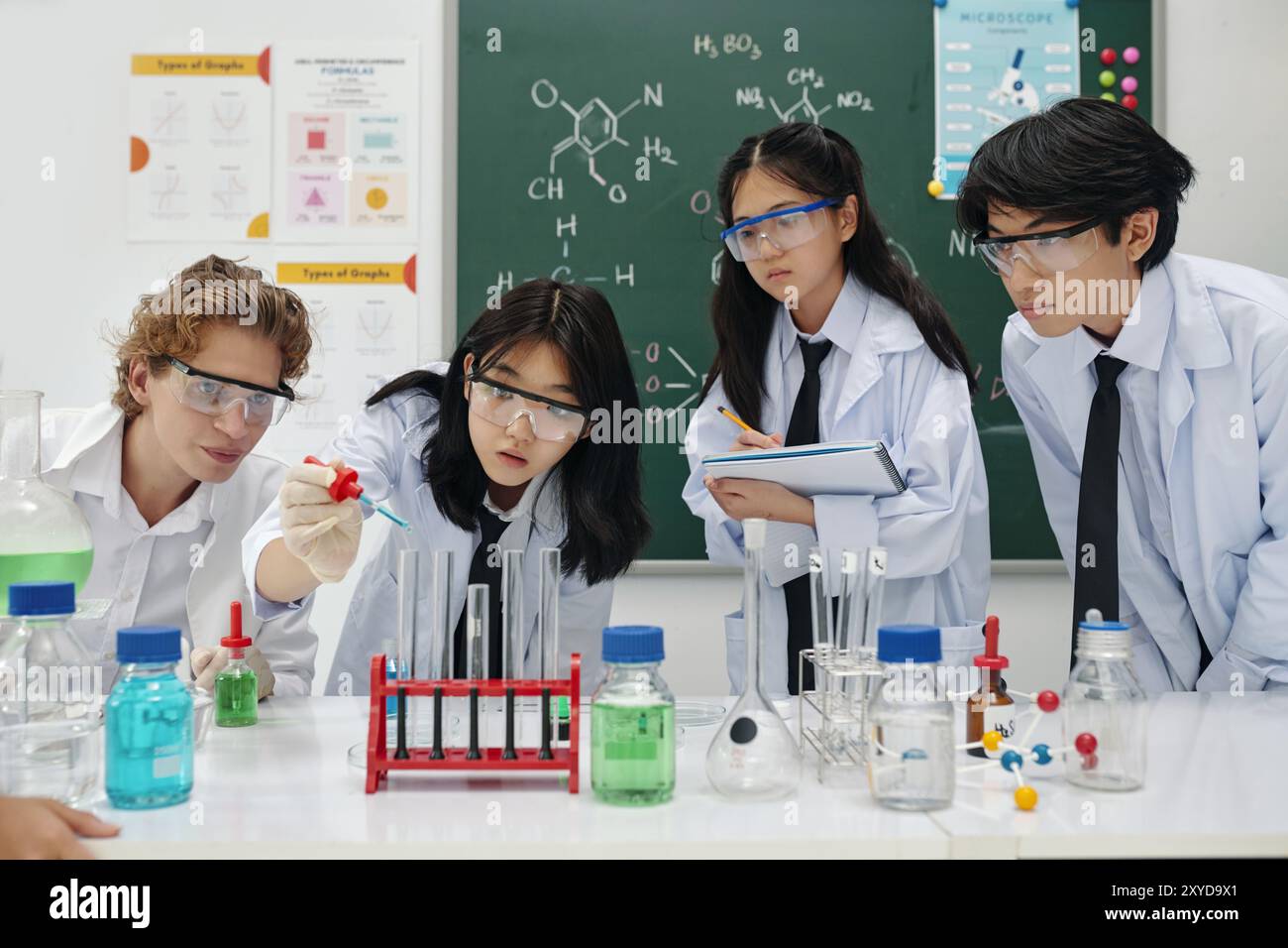 Conducting Science Experiment in Laboratory with Students Stock Photo ...