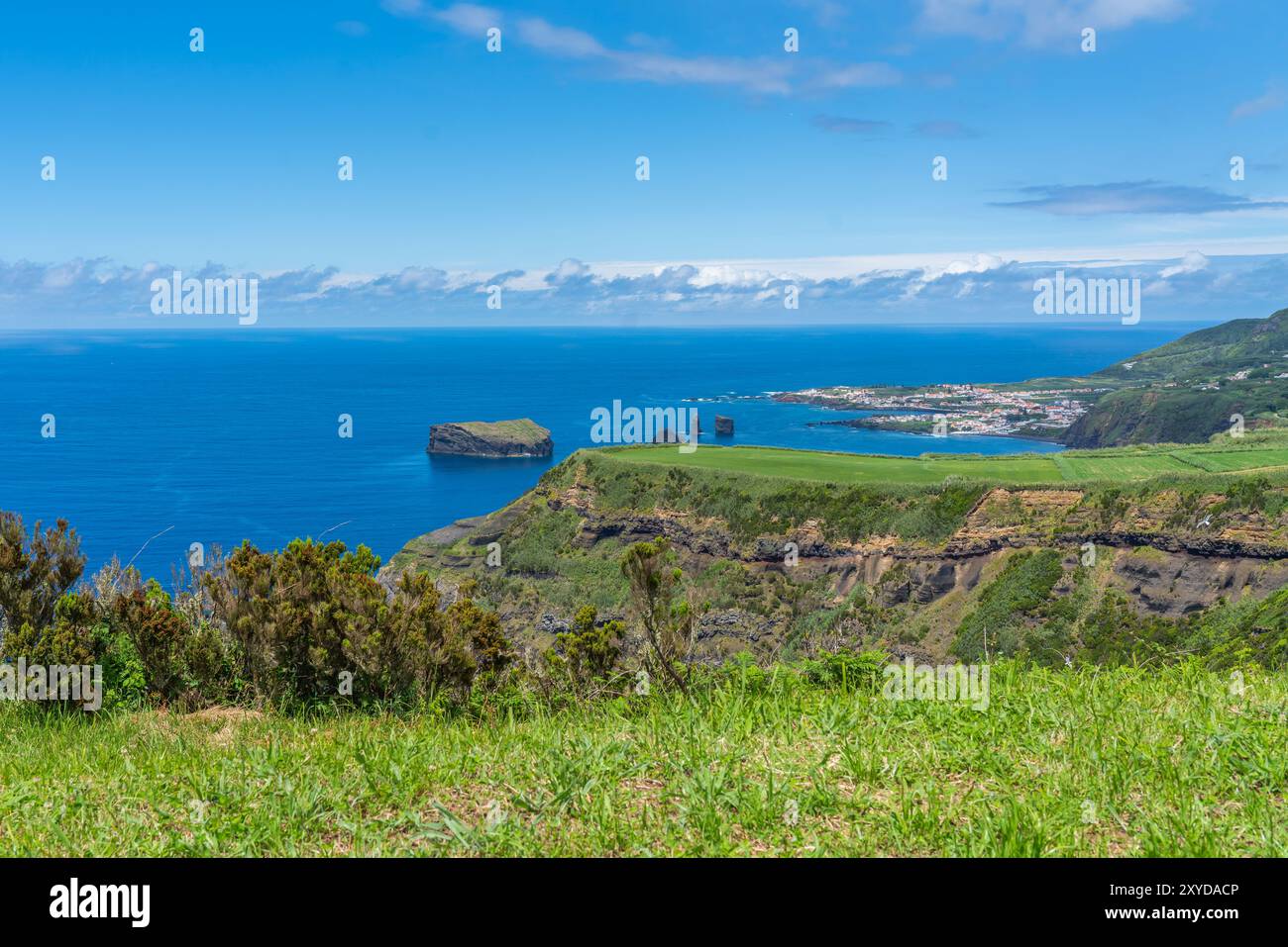 Coastal view with Atlantic Ocean and green meadows at Ponta da Ferraria ...