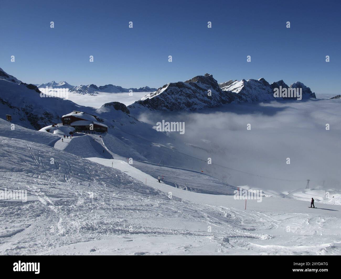 Ski slopes just above the fog, Titlis ski area Stock Photo - Alamy