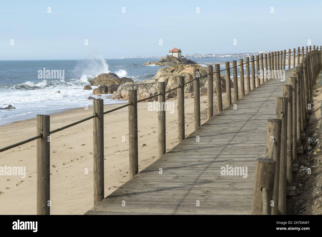 Boardwalk on the sandy beach, in the background the Capela do Senhor da ...