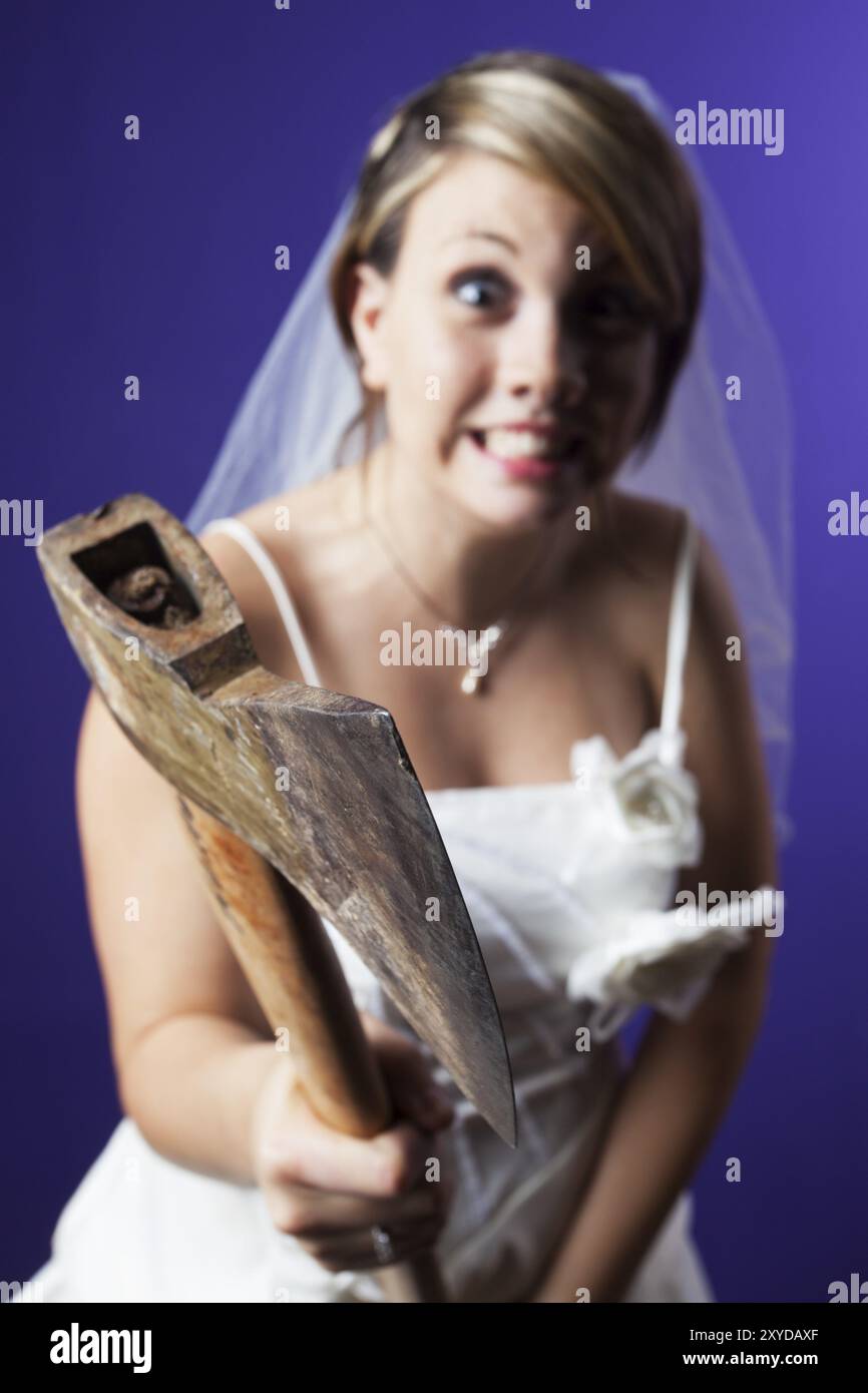 Young bride with an axe Stock Photo - Alamy