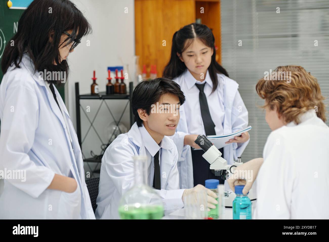 Students Conducting Science Experiment in Laboratory Stock Photo - Alamy