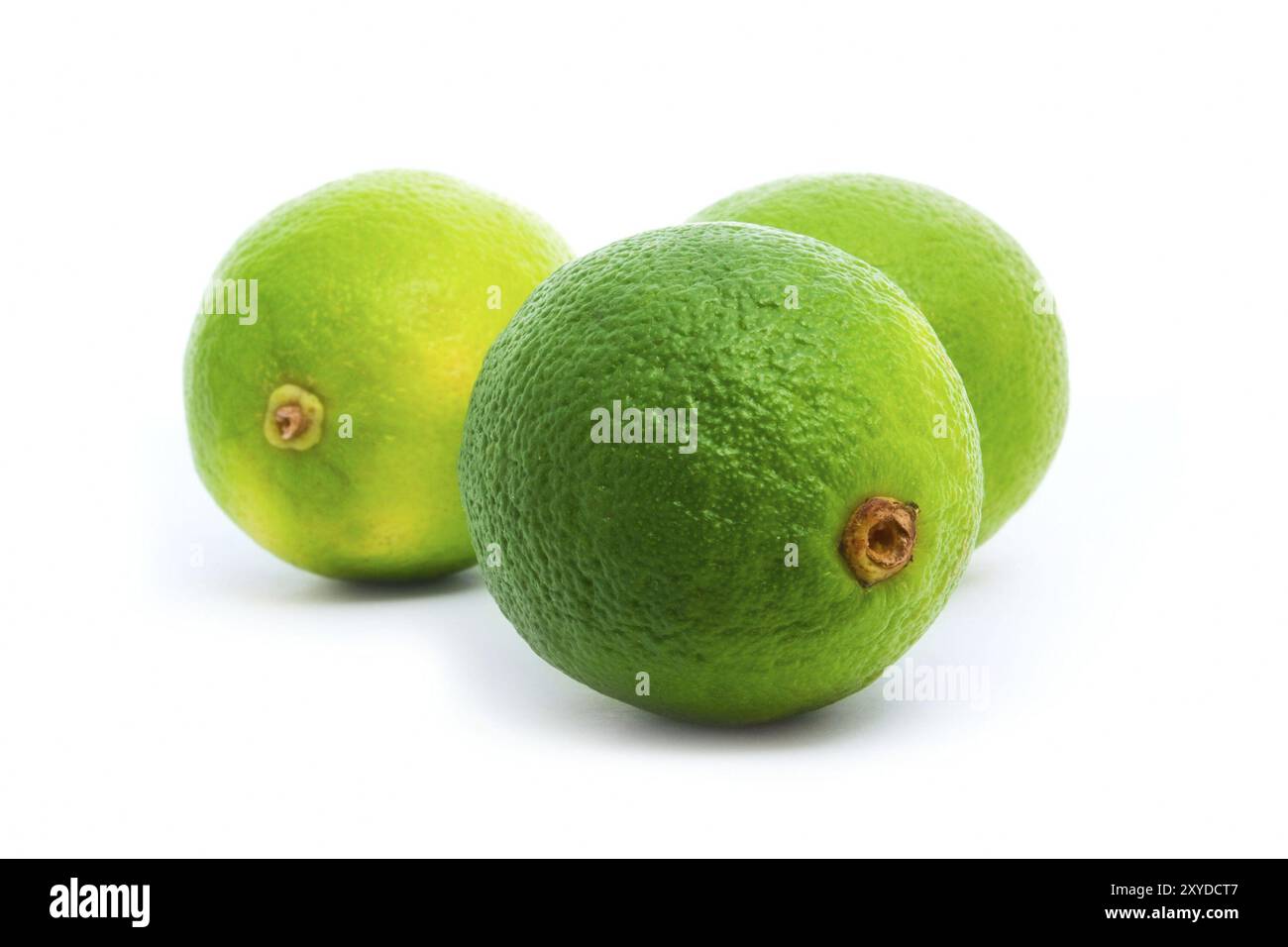 Fresh green limes isolated on white background Stock Photo - Alamy