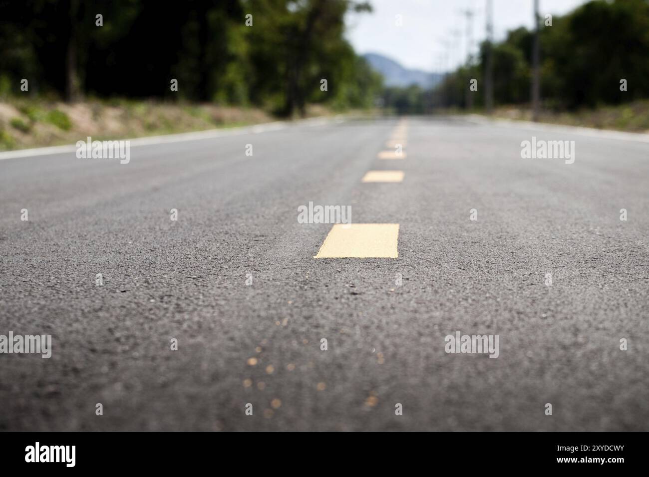 A long stretch of road with dividing line Stock Photo - Alamy